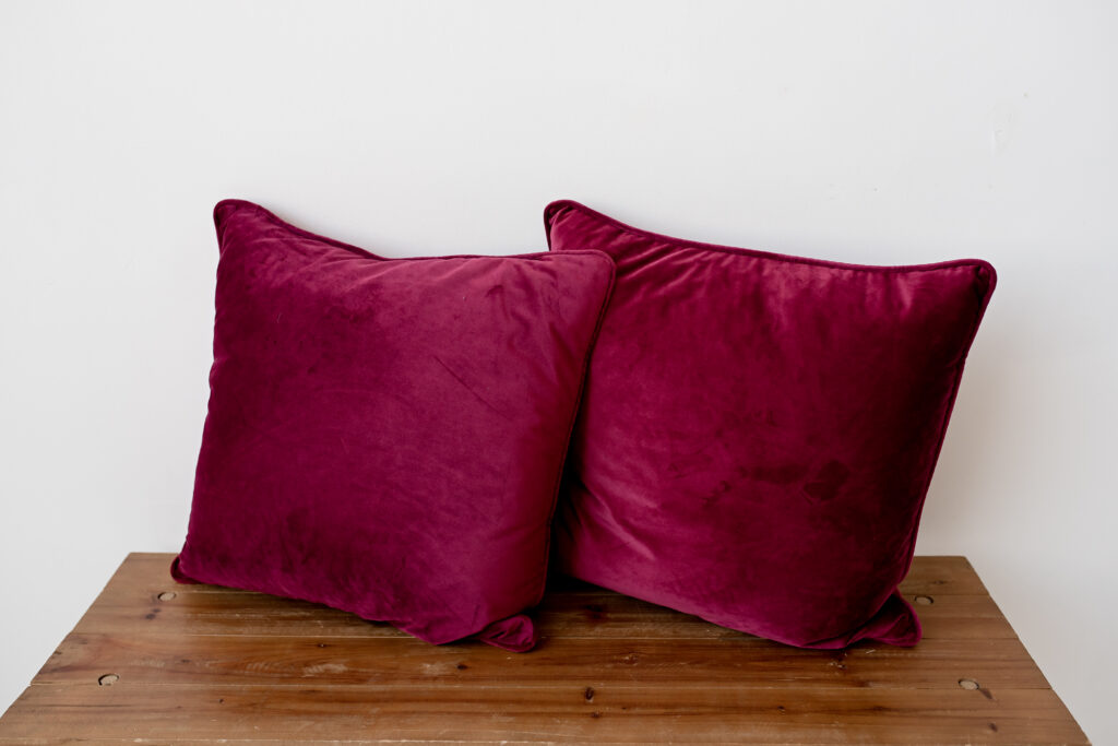 Raspberry Velvet Square Pillows | Lost and Found Event Rentals